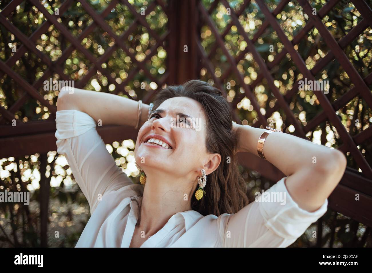 relaxed 40 years old housewife in white shirt in the terrace Stock ...