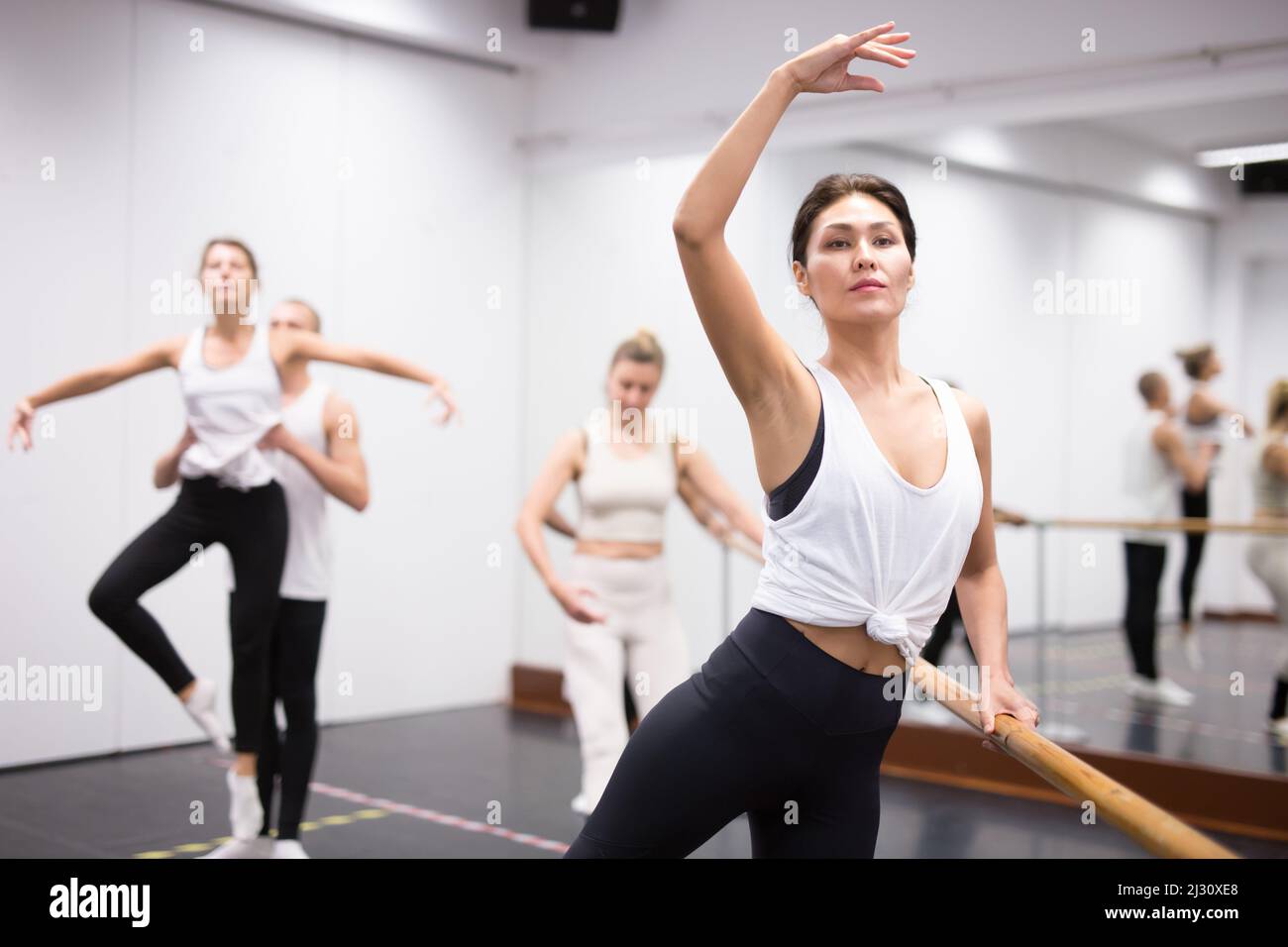Asian girl in ballet class with other dancers Stock Photo - Alamy