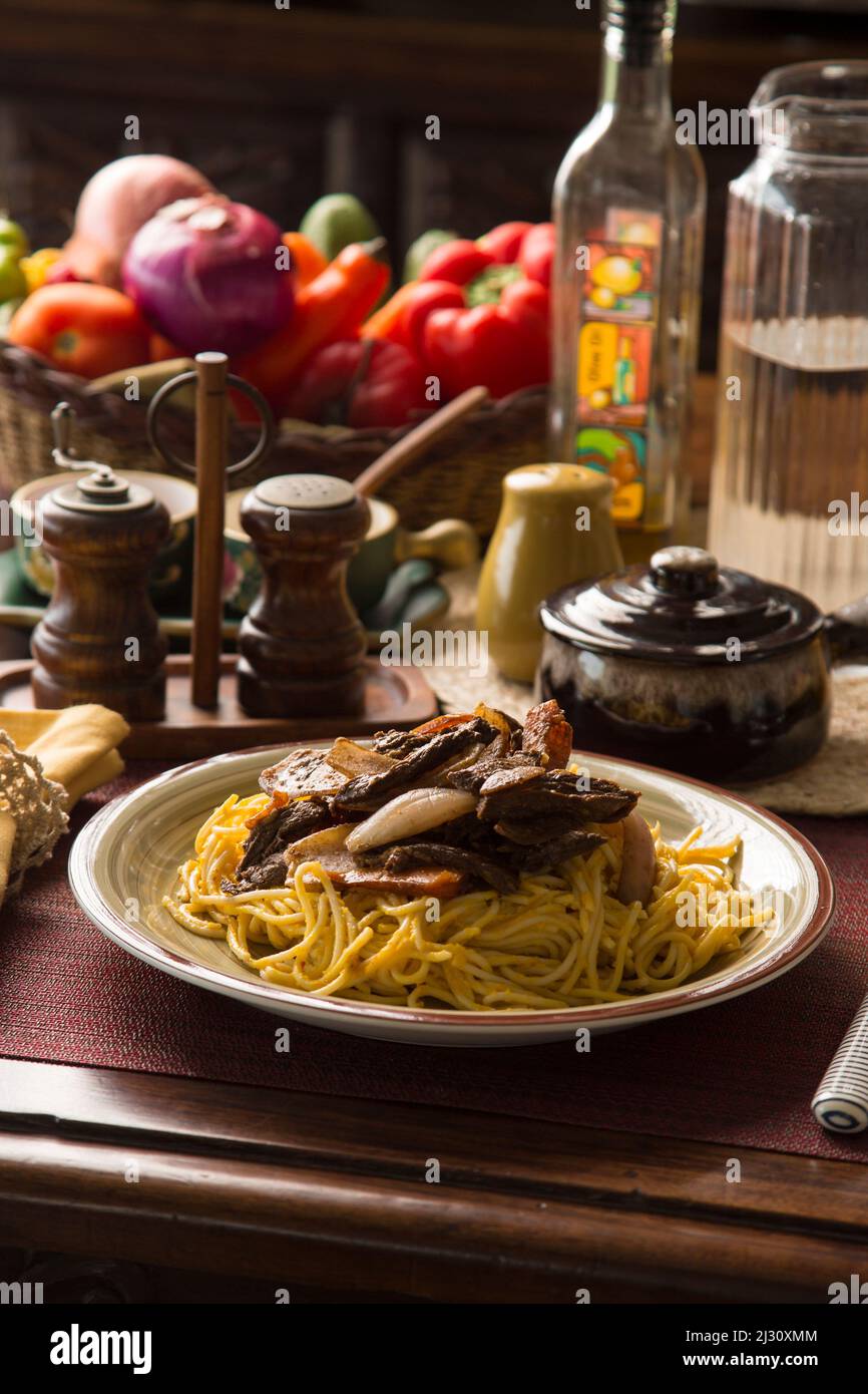 Huancaina noodle pasta with lomo saltado sauted beef meat Peruvian ...