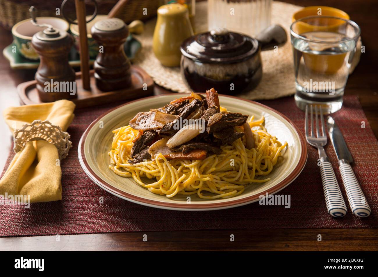 Huancaina noodle pasta with lomo saltado sauted beef meat Peruvian ...