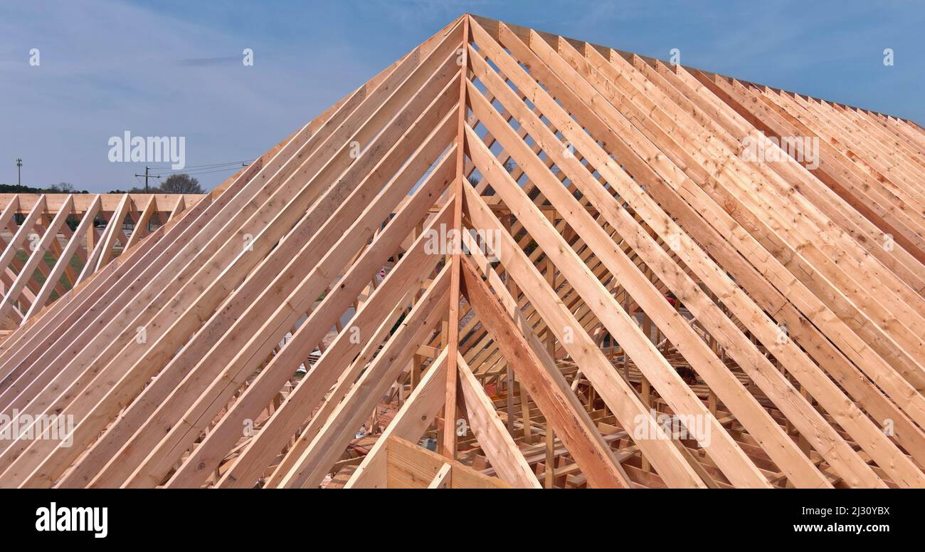 Newly built wooden skeleton frame of house roof section Stock Photo - Alamy