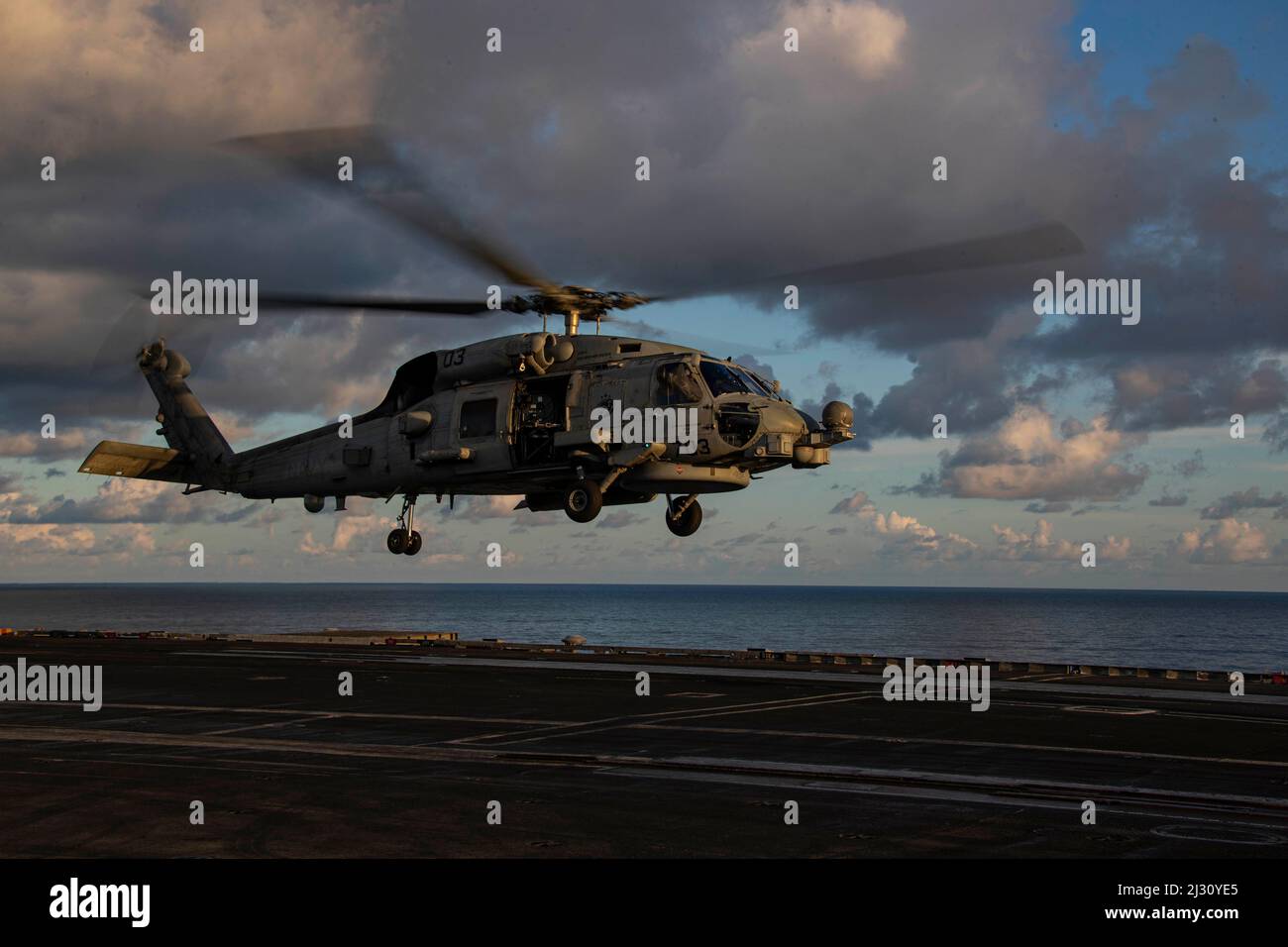 SOUTH CHINA SEA (April 2, 2022) An MH-60R Sea Hawk helicopter, assigned ...