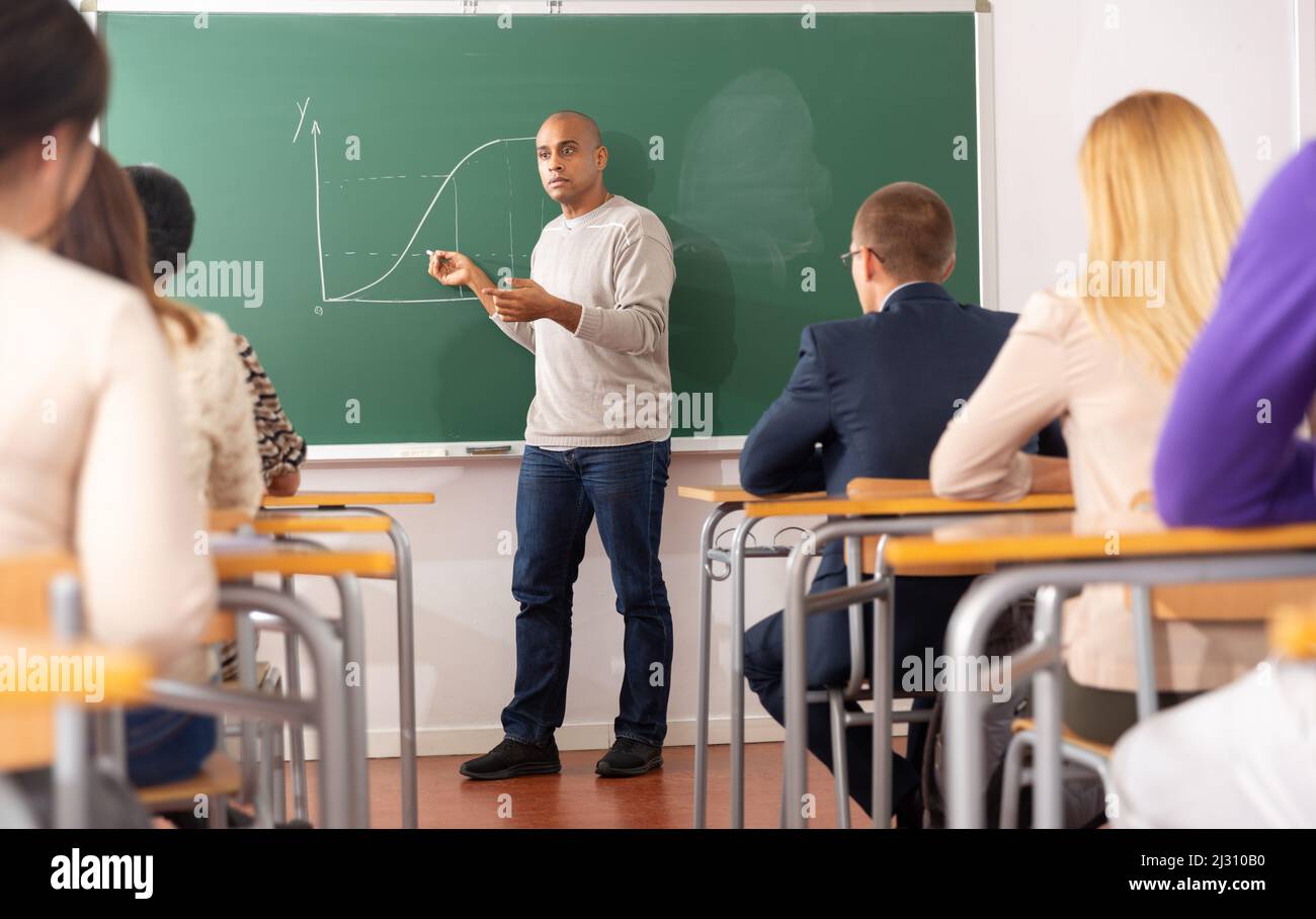 Teacher conducts refresher course for employees Stock Photo - Alamy