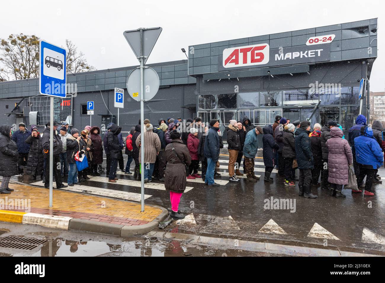 Bucha, Ukraine. 03rd Apr, 2022. People queue to receive humanitarian ...