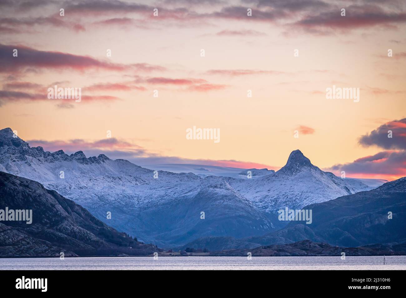 Mountain ranges at the Arctic Circle with a beautiful red morning ...