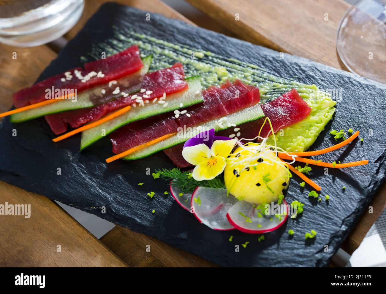 Raw tuna sashimi with cucumber and avocado sauce Stock Photo - Alamy