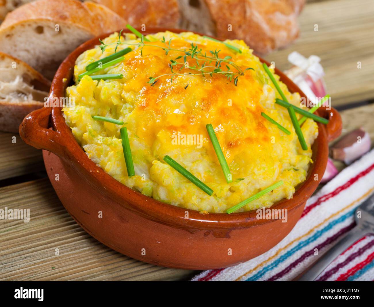 Clay pot of potato casserole Stock Photo - Alamy