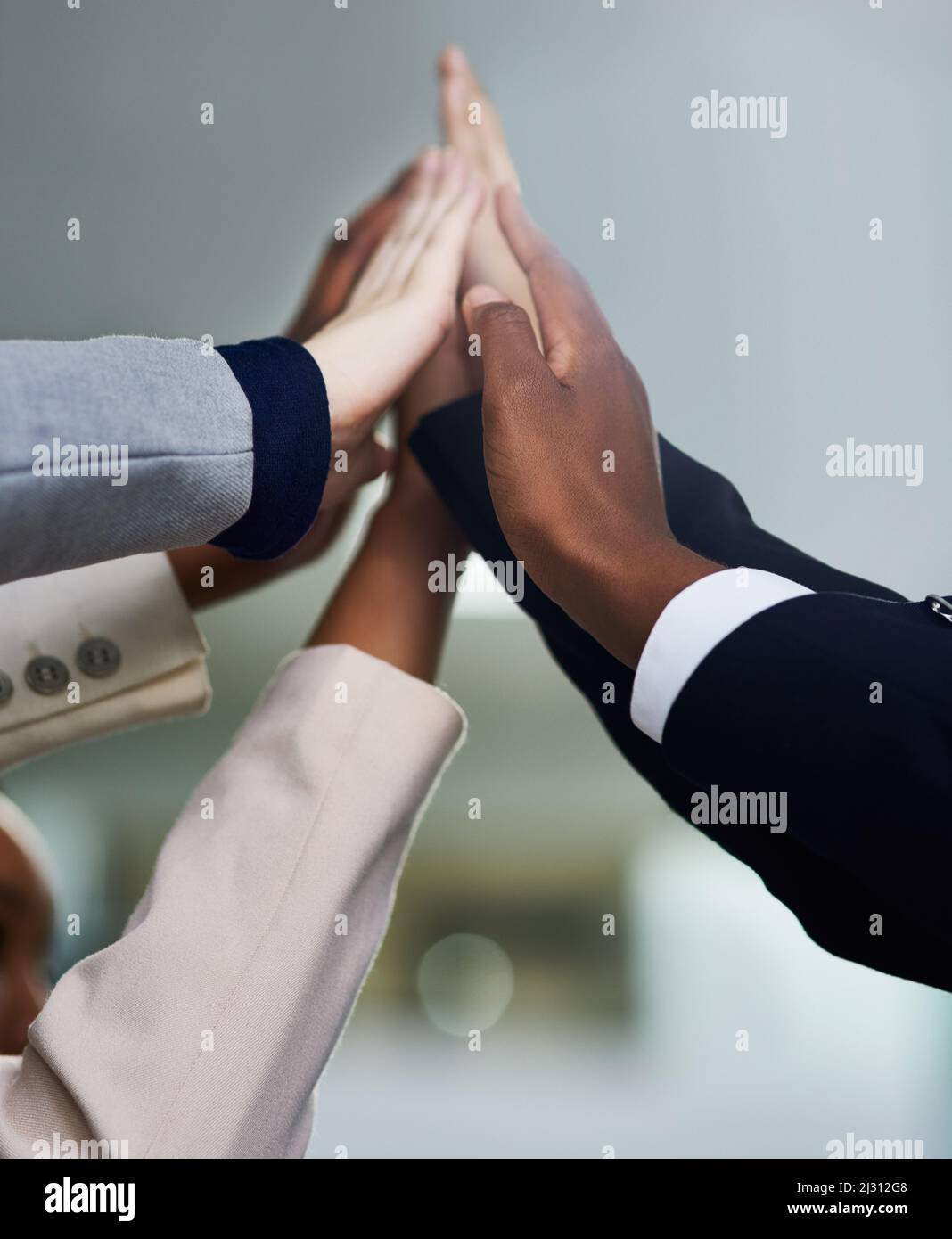 With teamwork, success is inevitable. Cropped shot of a group of ...