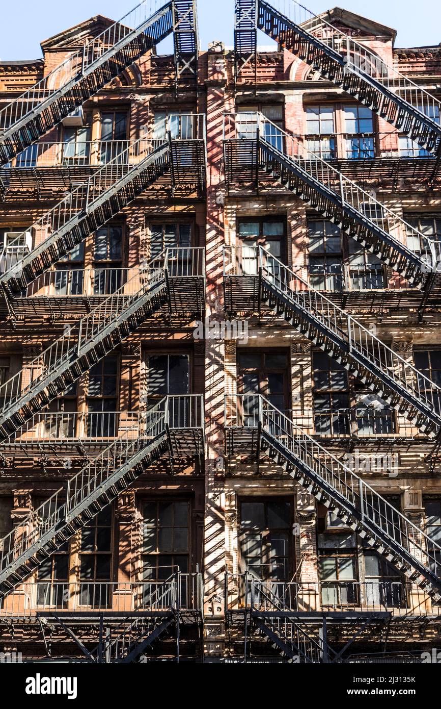 NEW YORK, USA - OCT 5, 2017: iron fire ladder at the facade of an old ...