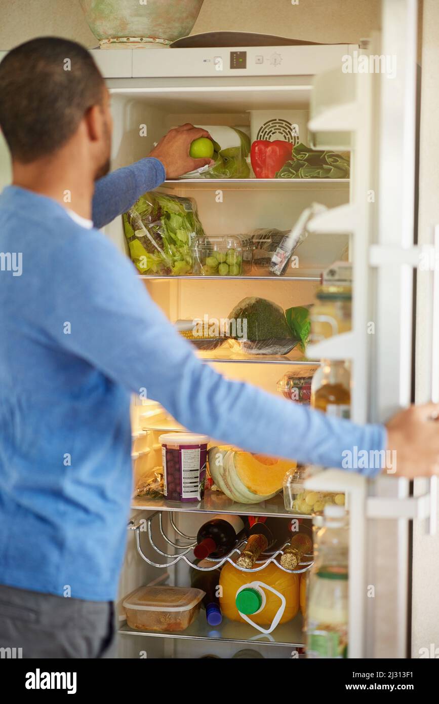 Man opening fridge hi-res stock photography and images - Alamy