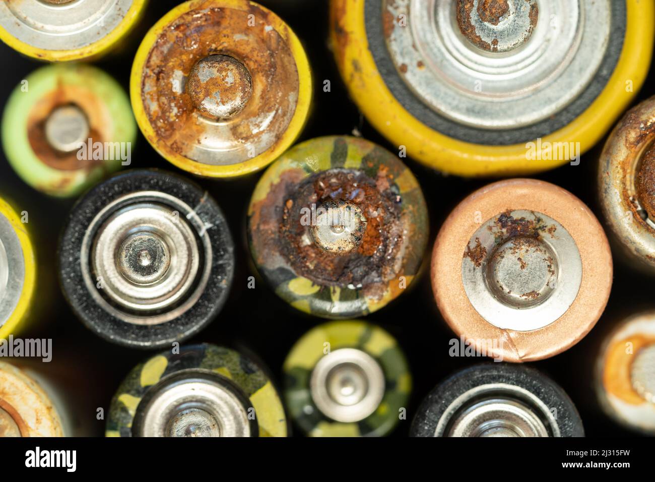 Closeup of used battery with traces of rust and corrosion. Electronic ...