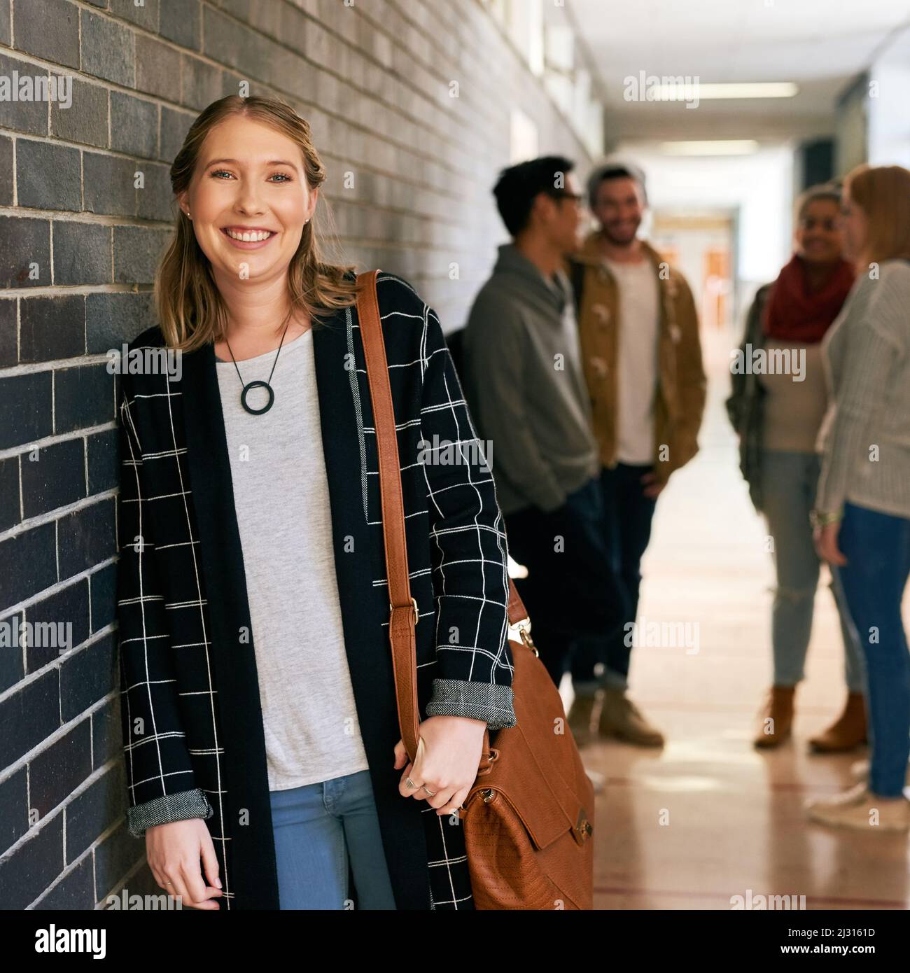 Im enjoying my first year on campus. Portrait of a young female ...