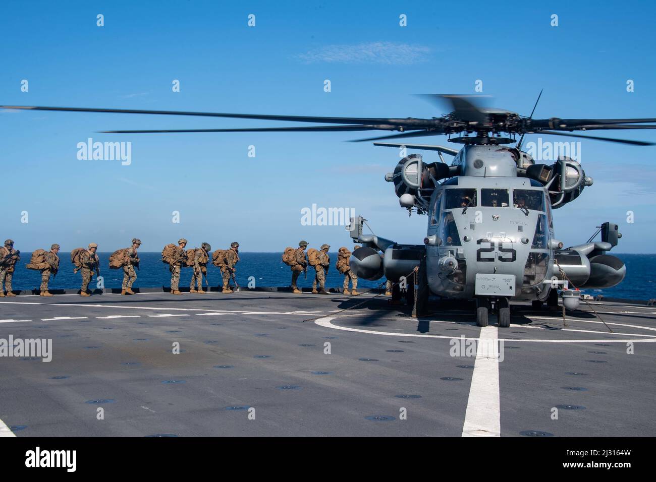 U.S. Marines with 1st Battalion, 3rd Marines, 3rd Marine Division board a CH-53E Super Stallion ...