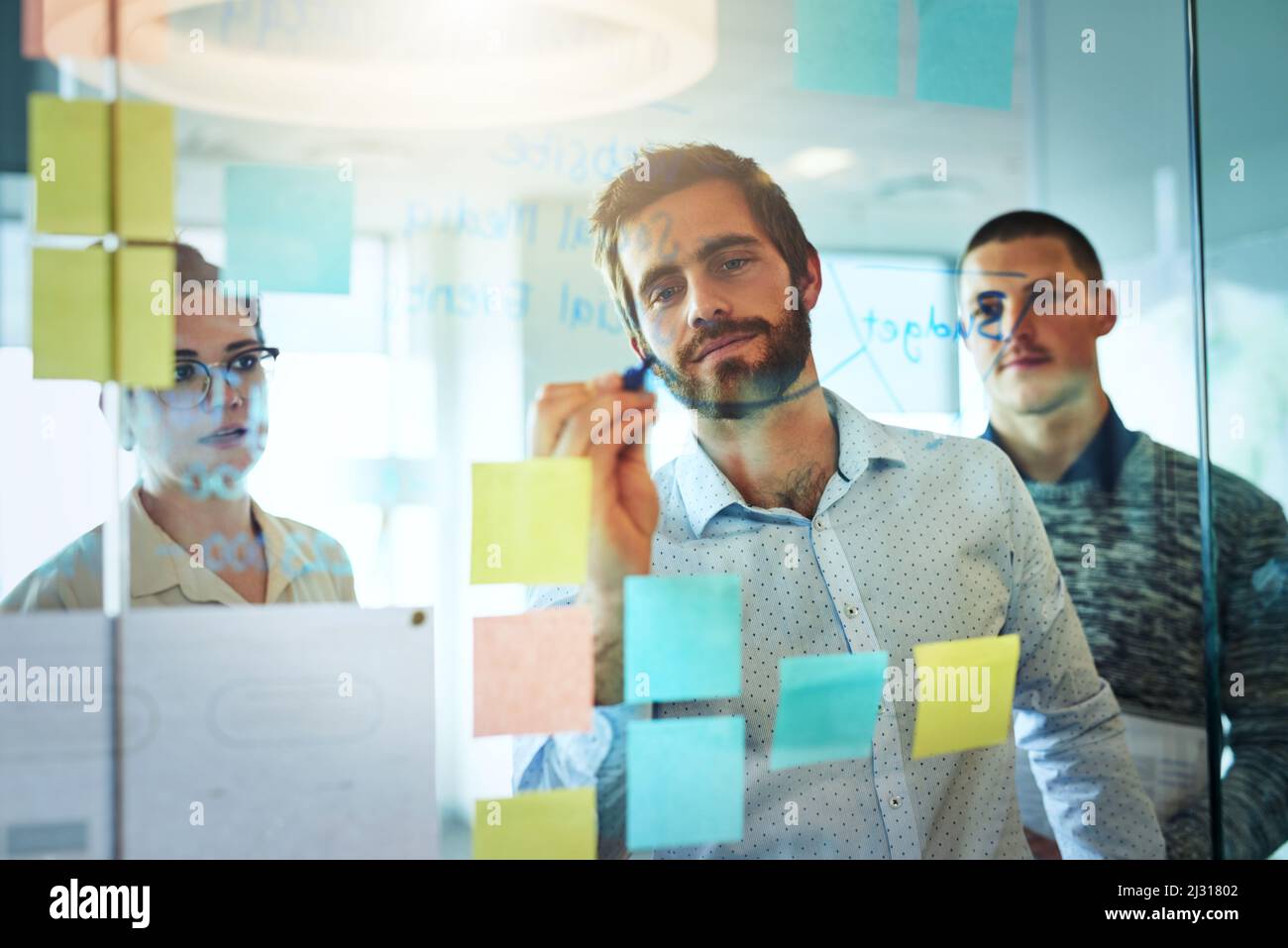 Putting in maximum effort to produce the best results. Shot of a group ...