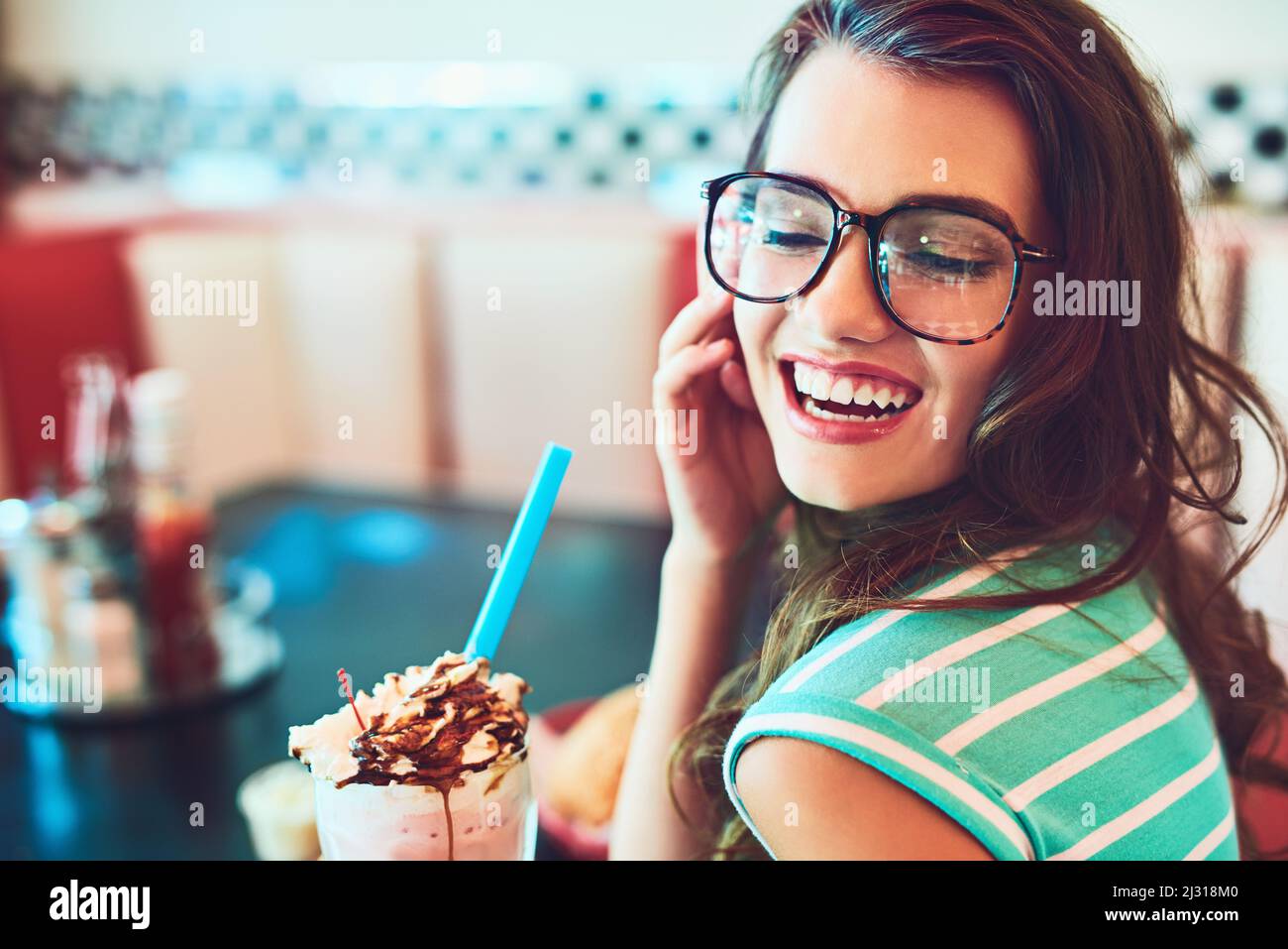 In her favourite booth. Cropped shot of an attractive young woman ...