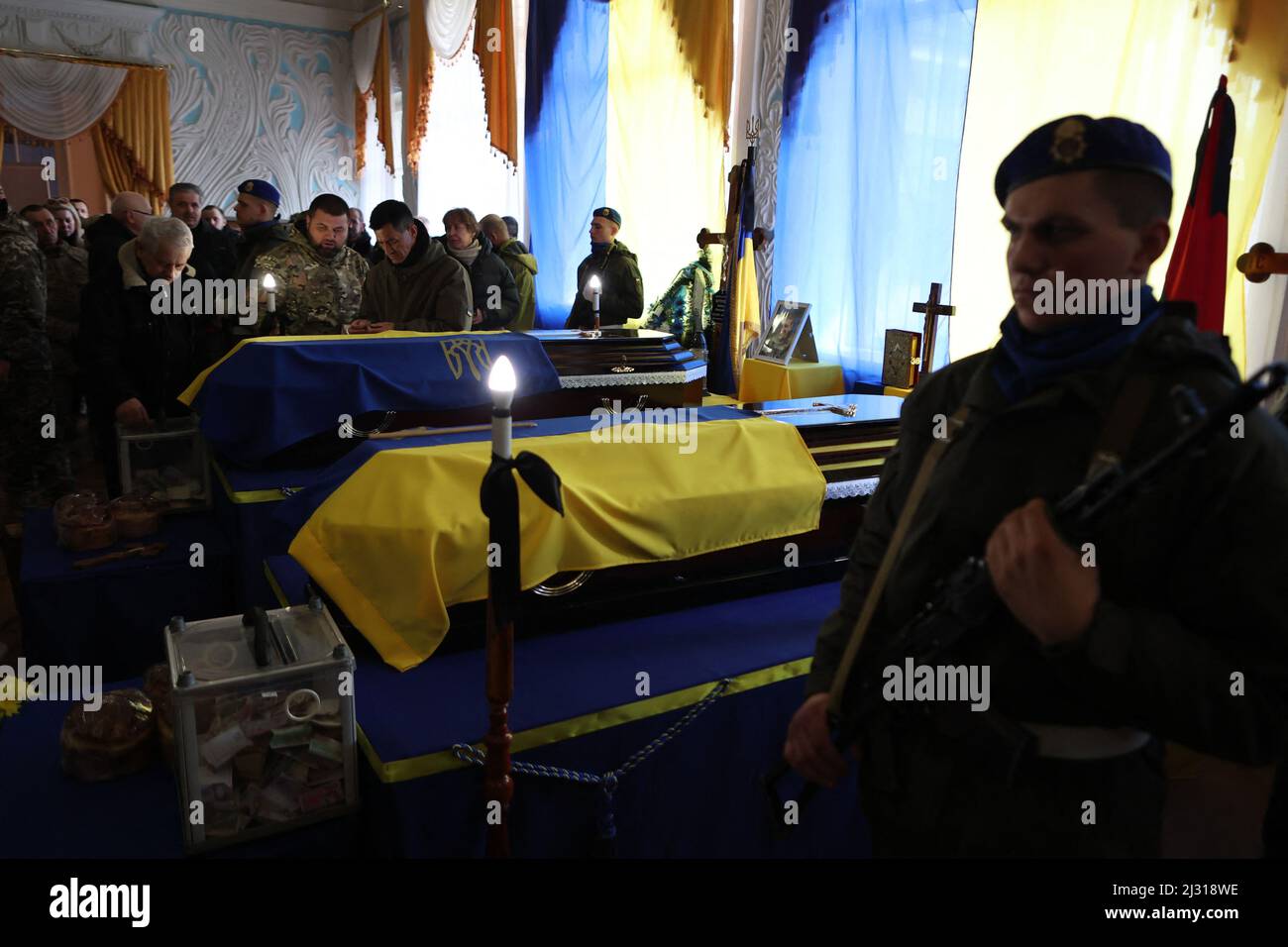 Coffins are seen during a funeral ceremony for Ukrainian defenders ...