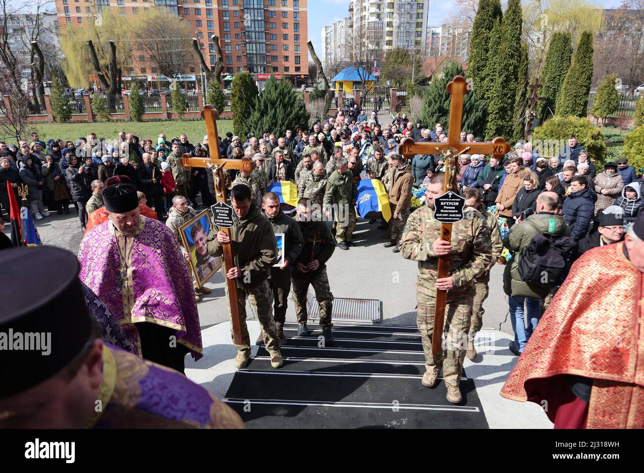 Soldiers carry crosses during a funeral ceremony for Ukrainian ...