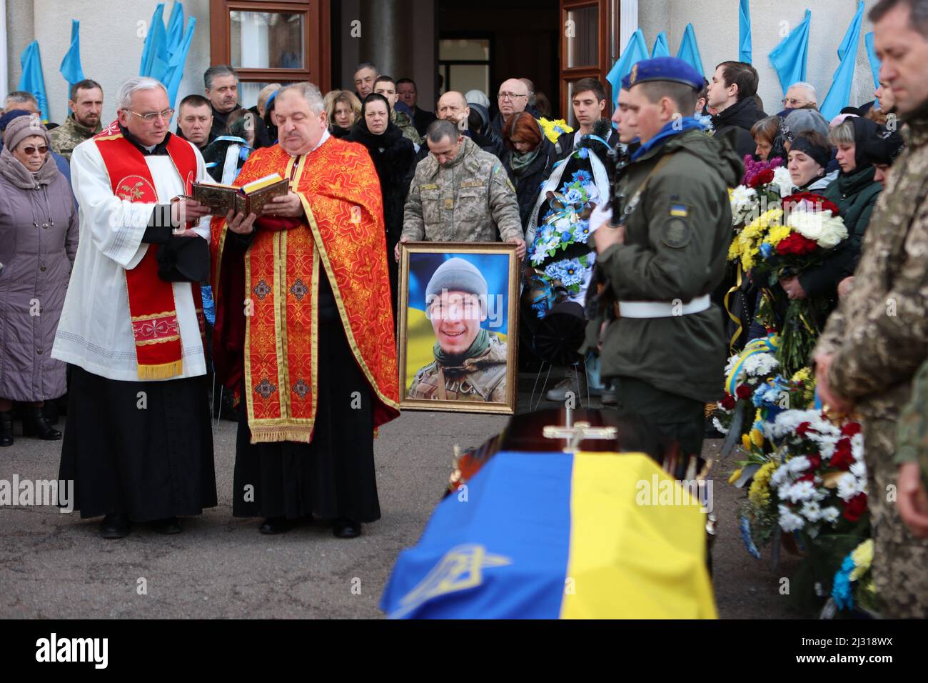Priests conduct a funeral ceremony for Ukrainian defenders, brothers ...