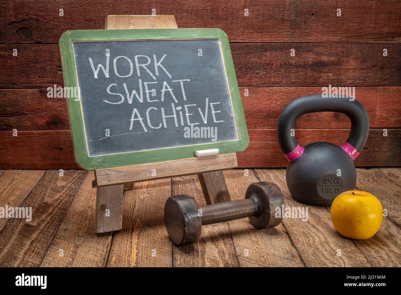 work, sweat, achieve - motivational writing with white chalk on a ...