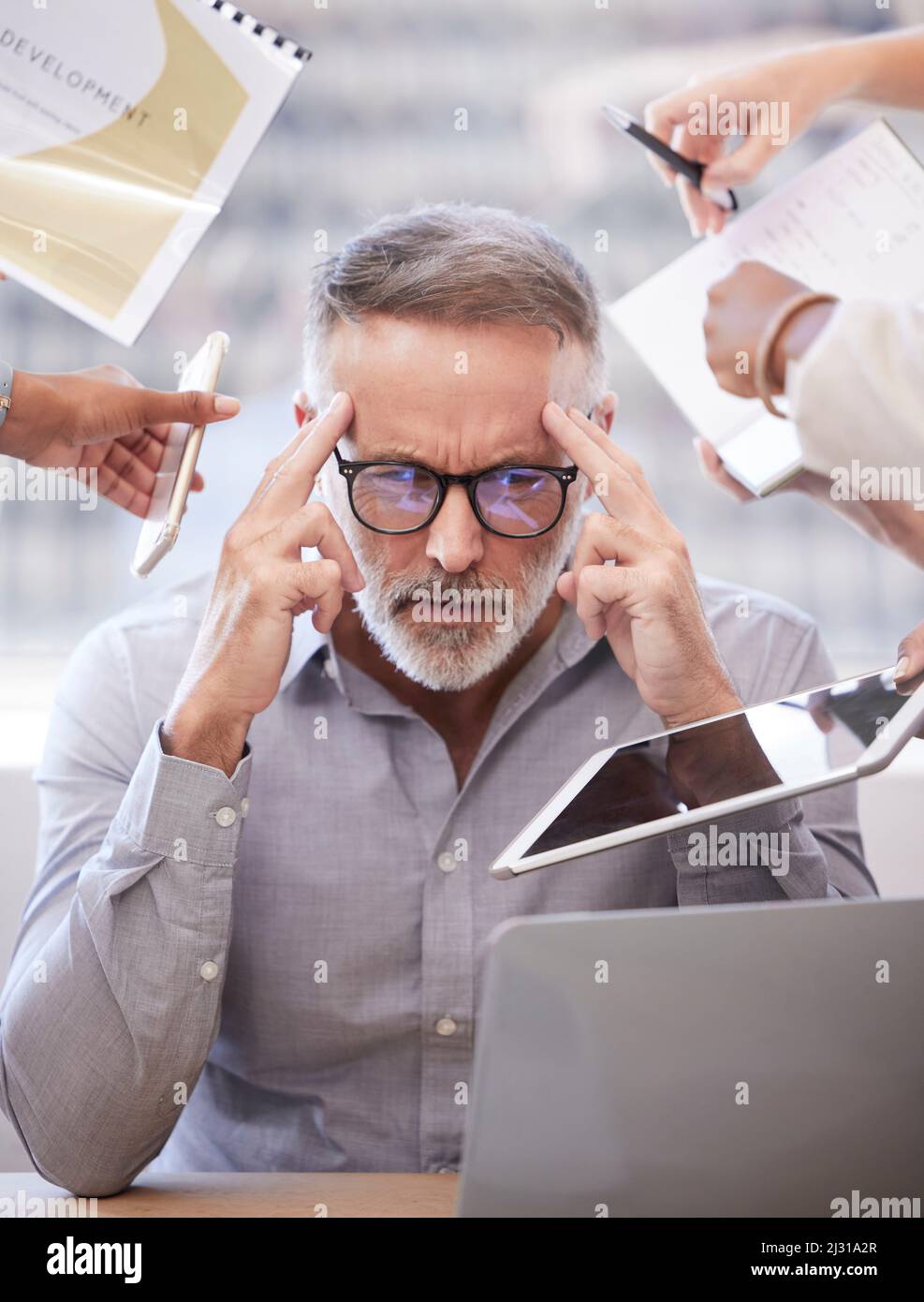 Feeling a bit overwhelmed. Cropped shot of a handsome mature ...