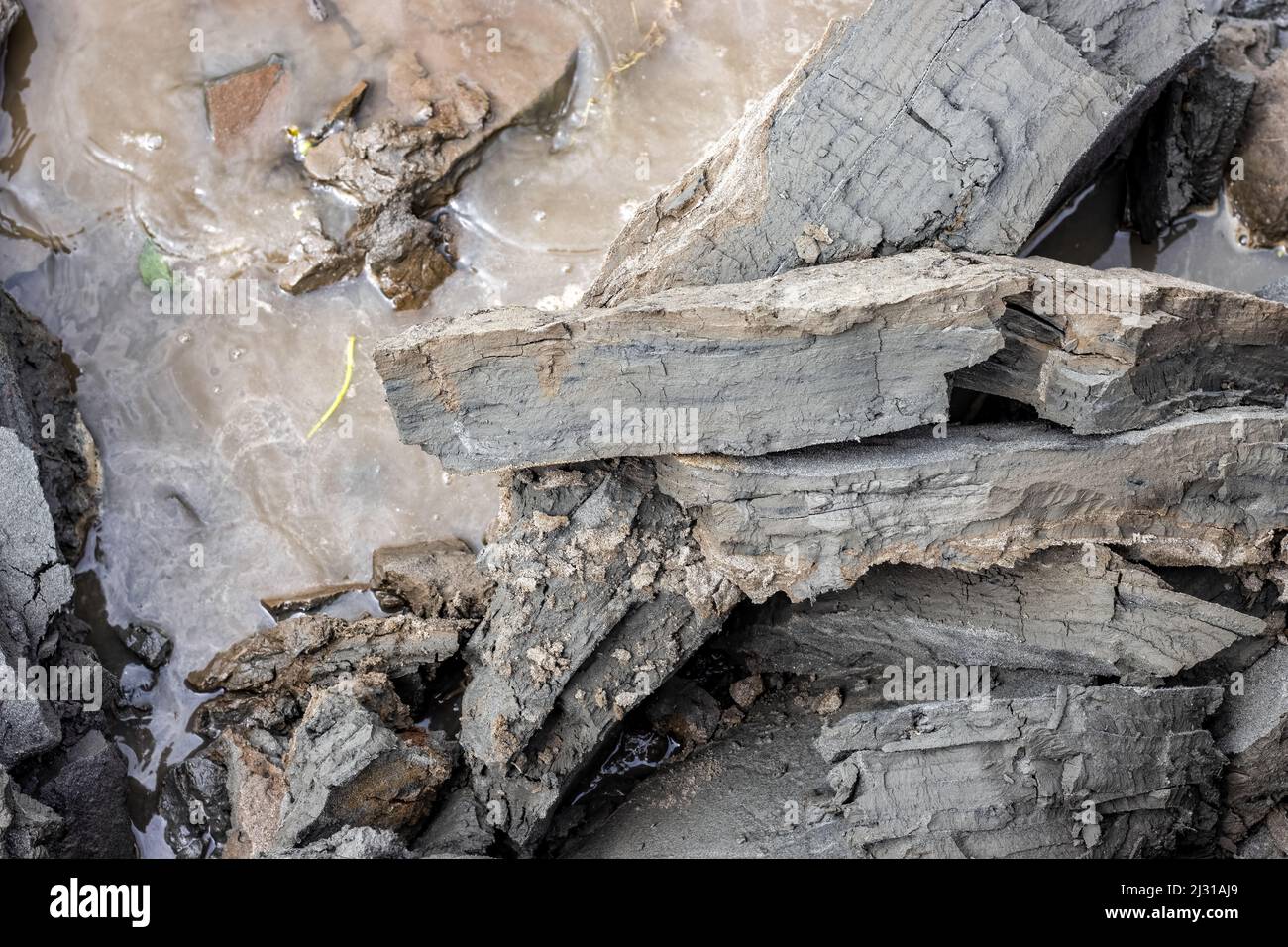 Close up shot of broken riverbank due to river erosion Stock Photo - Alamy