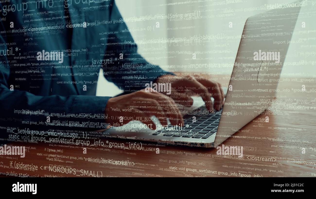 Computer Programmer Uses Capable Laptop Computer To Develop Programming Code Of New Software