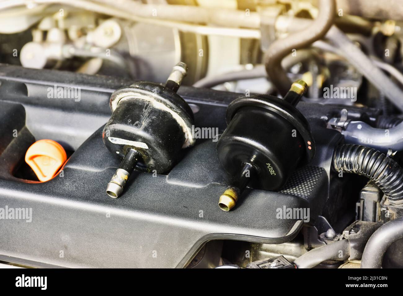 New and old gear oil filter compare of the transmission system on the ...