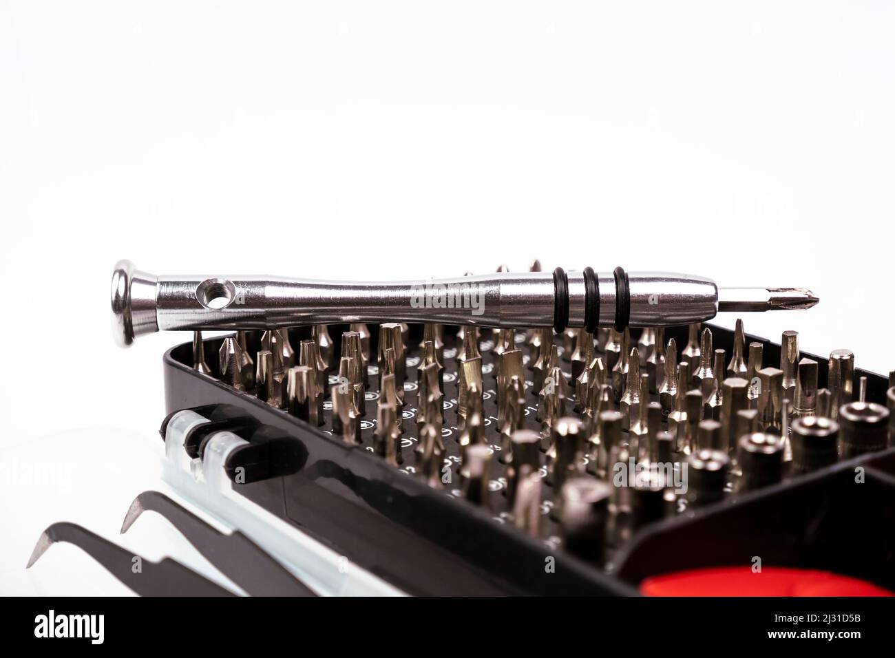Multi precision screwdriver set in the plastic box on white background ...