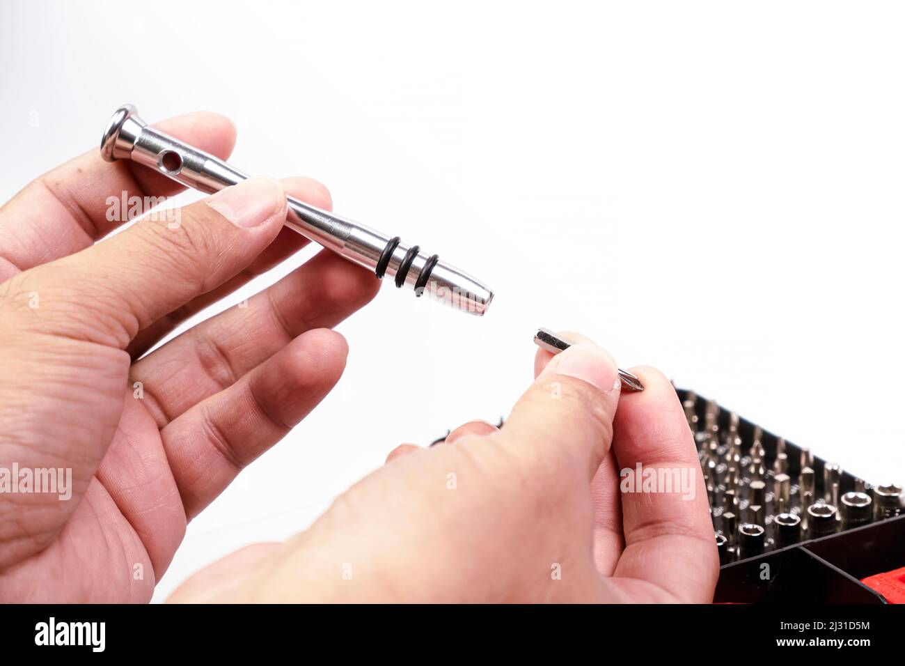 Hand is removing the precision screwdriver component for replacing the ...