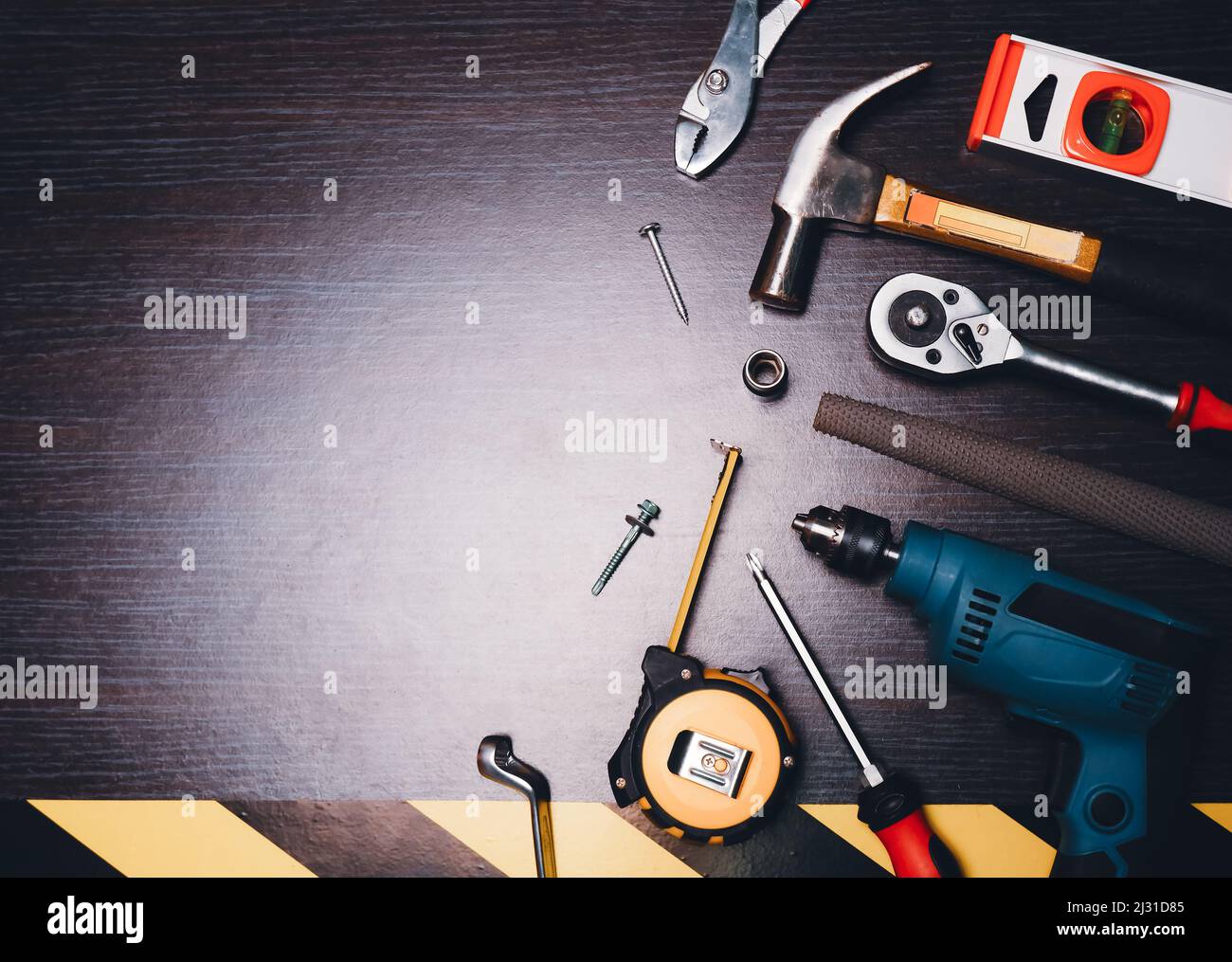 Mechanic tools on wooden background with copy space,drill,screwdriver ...