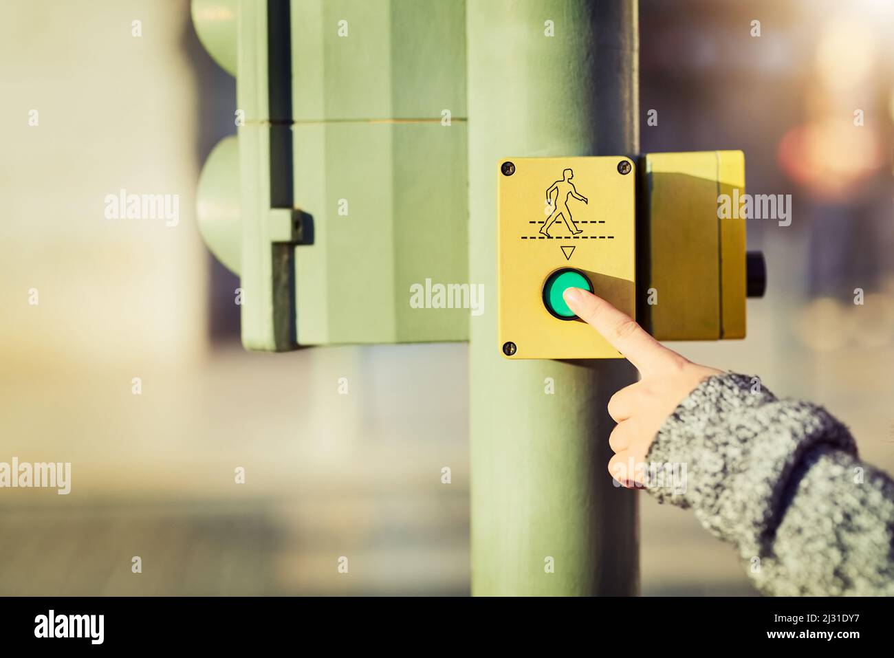 Crossing safely. Closeup shot of an unrecognizable woman pressing a ...