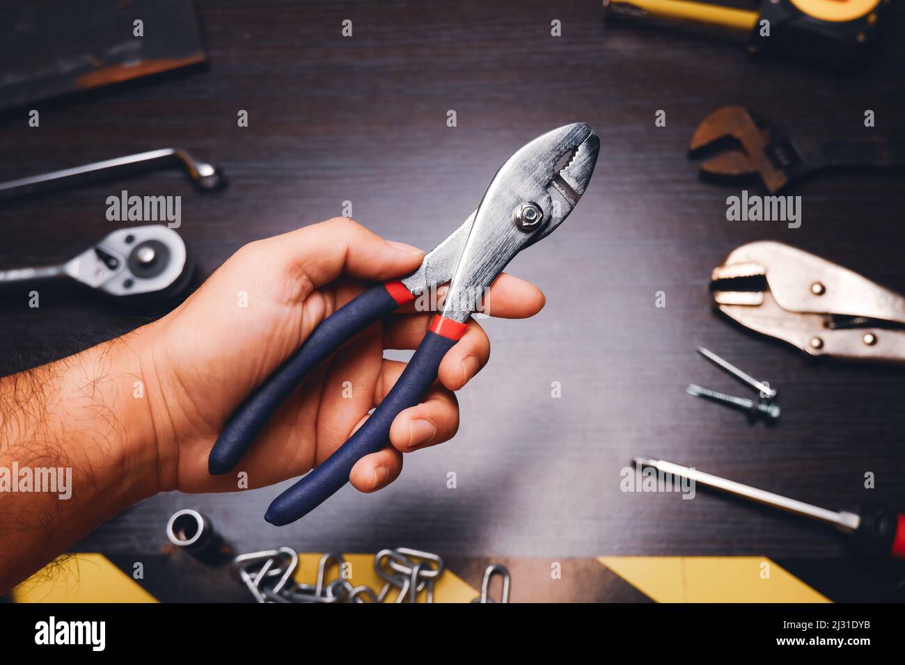Metal pliers isolated on the mechanic hand with a mechanic tools ...