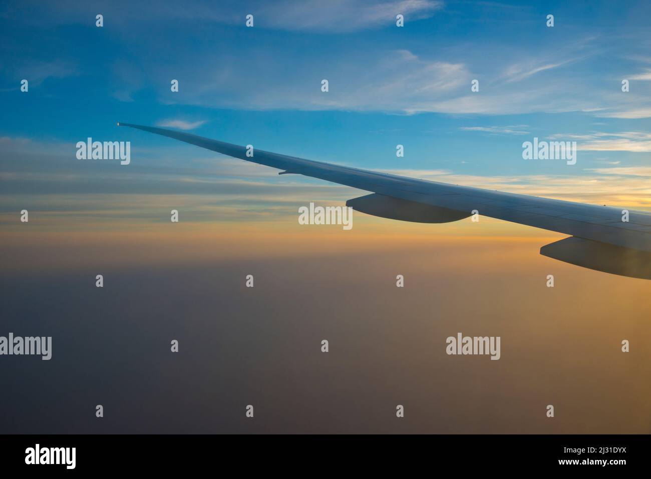 Airplane wing in sunset over the United Arab Emirates Stock Photo - Alamy
