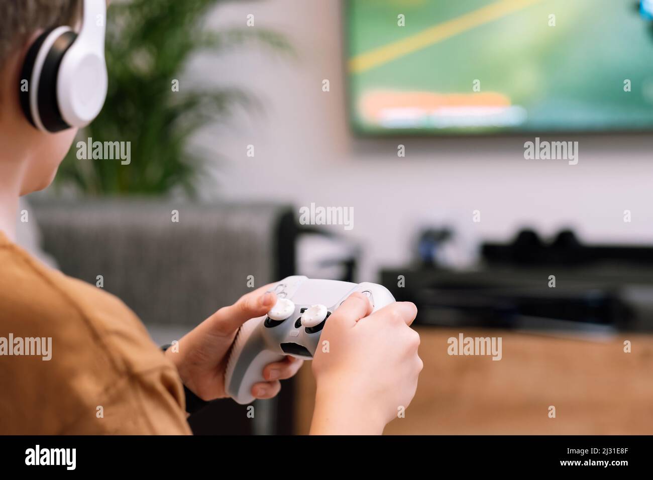 Close-up of teenager boy's hands holding joystick. Concept of playing ...