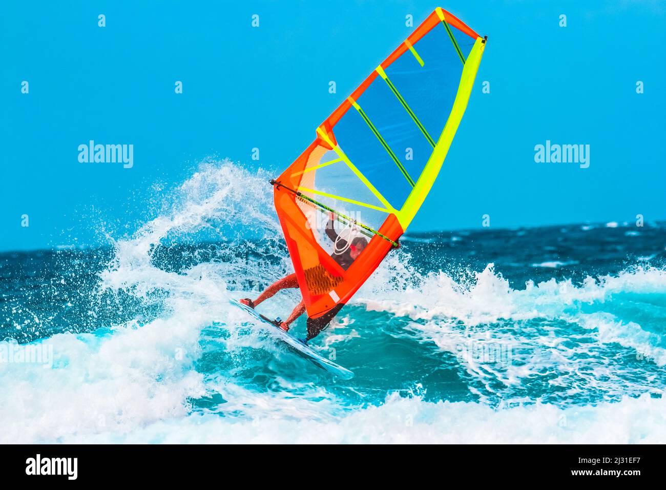 watersports: windsurf rides a wave in the Atlantic Ocean Stock Photo ...