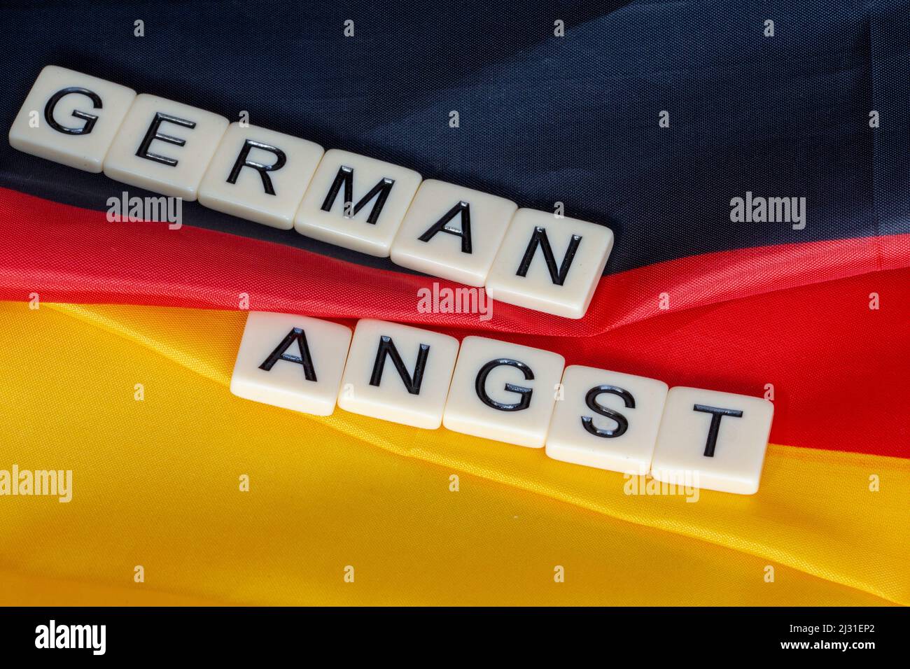 Symbol image German Angst: Letter cube on a Germany flag Stock Photo ...