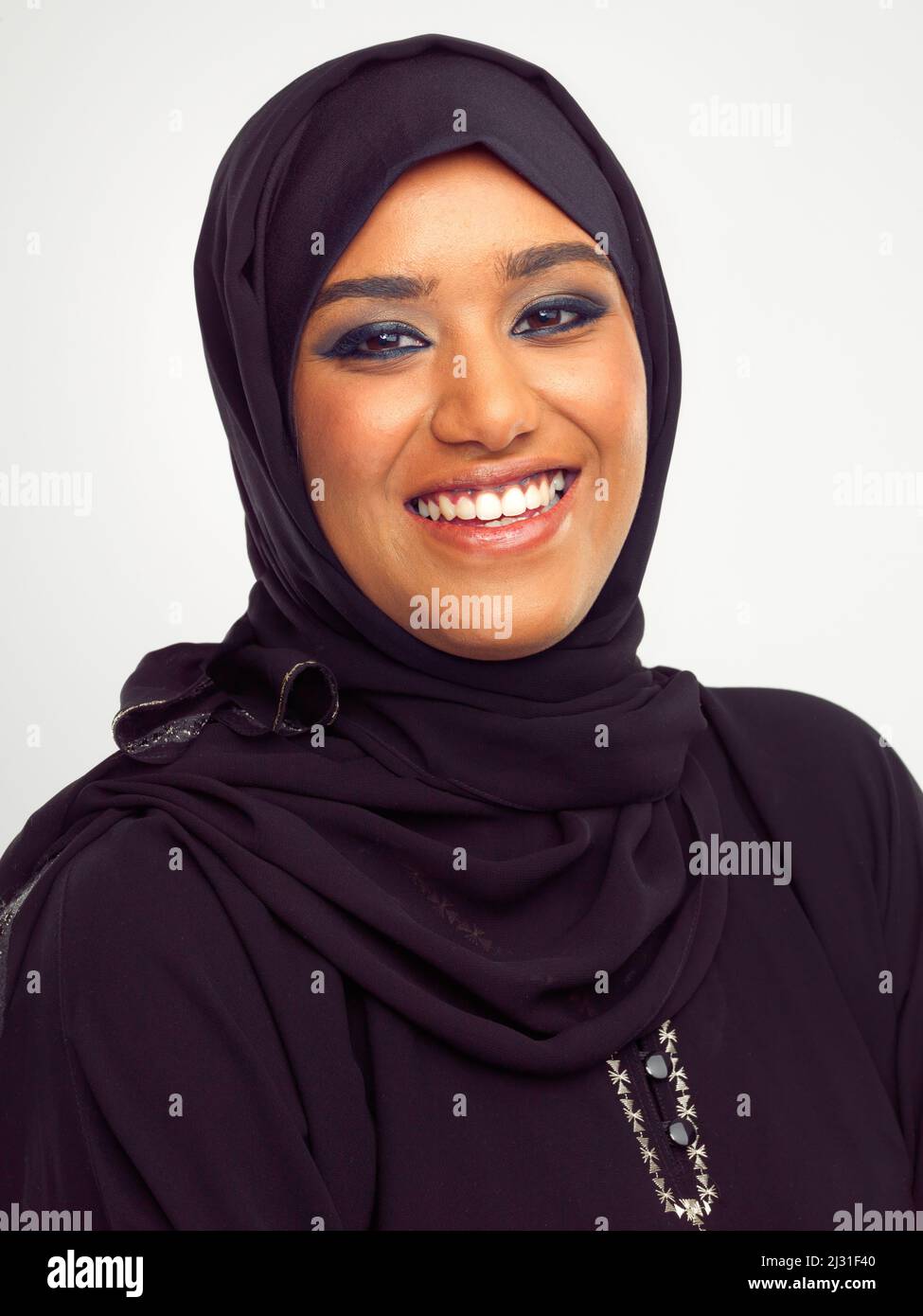 A smile that lights everyones heart. Studio portrait of a young muslim ...