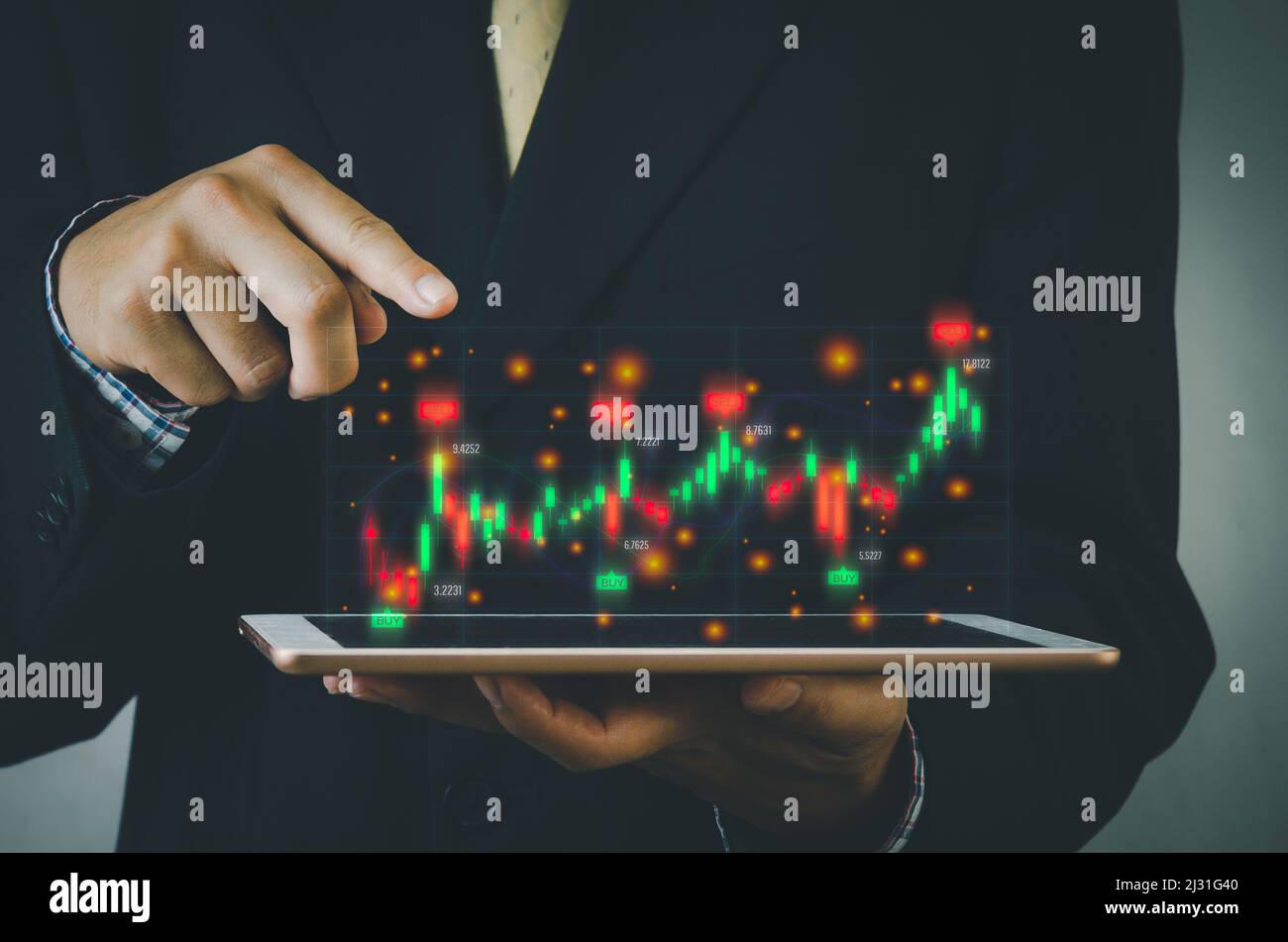 Businessman analyzing candlestick chart hi-res stock photography and ...