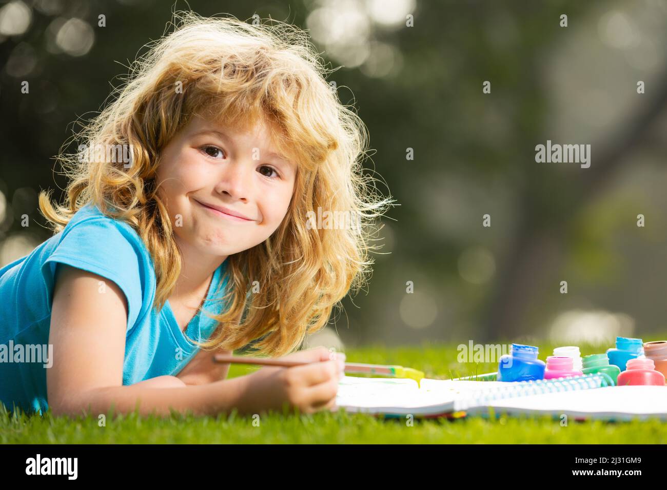 Happy talented boy artist painter. Child boy enjoying art and craft ...