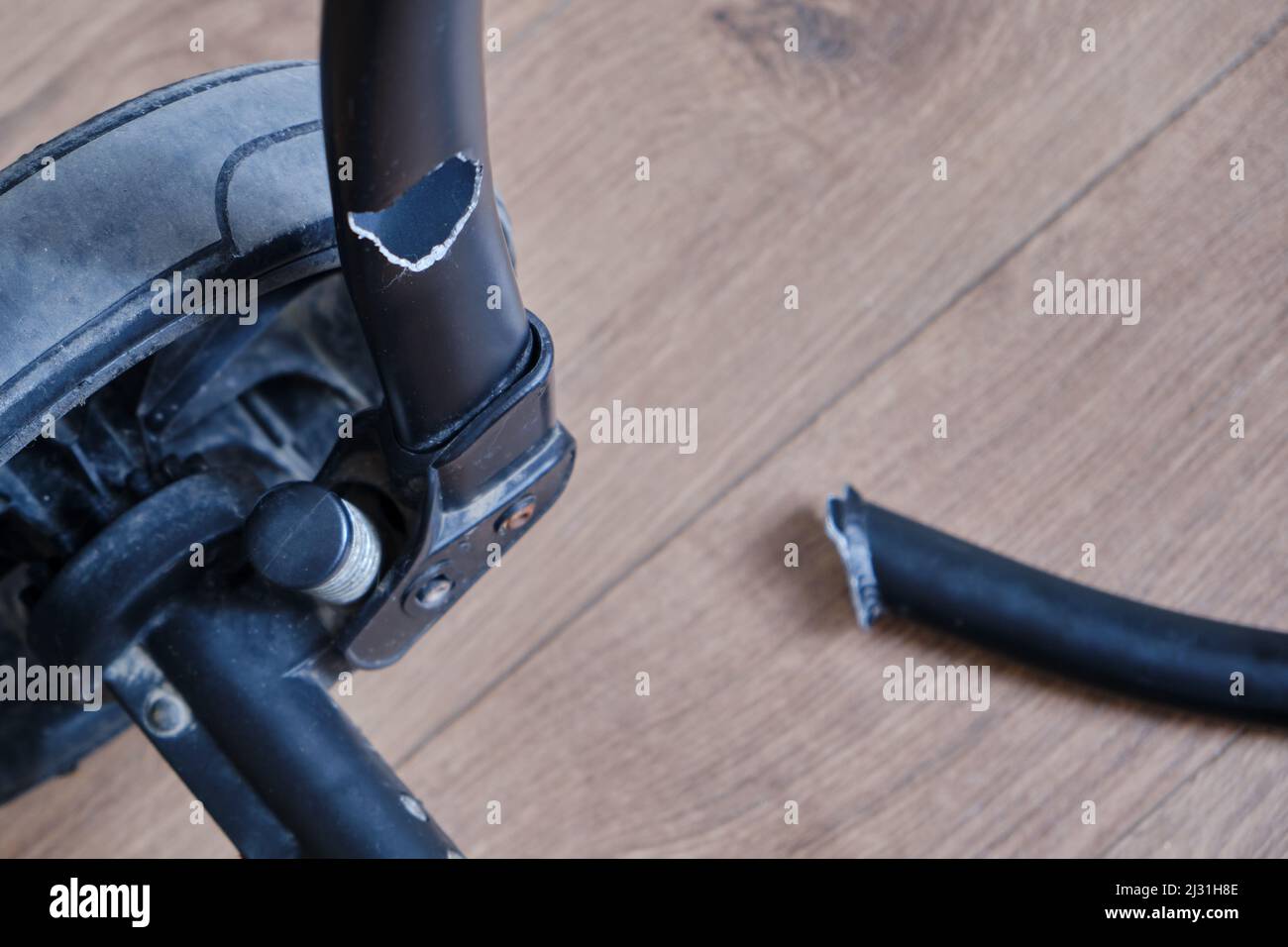 Broken chassis of a baby stroller, damage to the crossbar of the metal ...