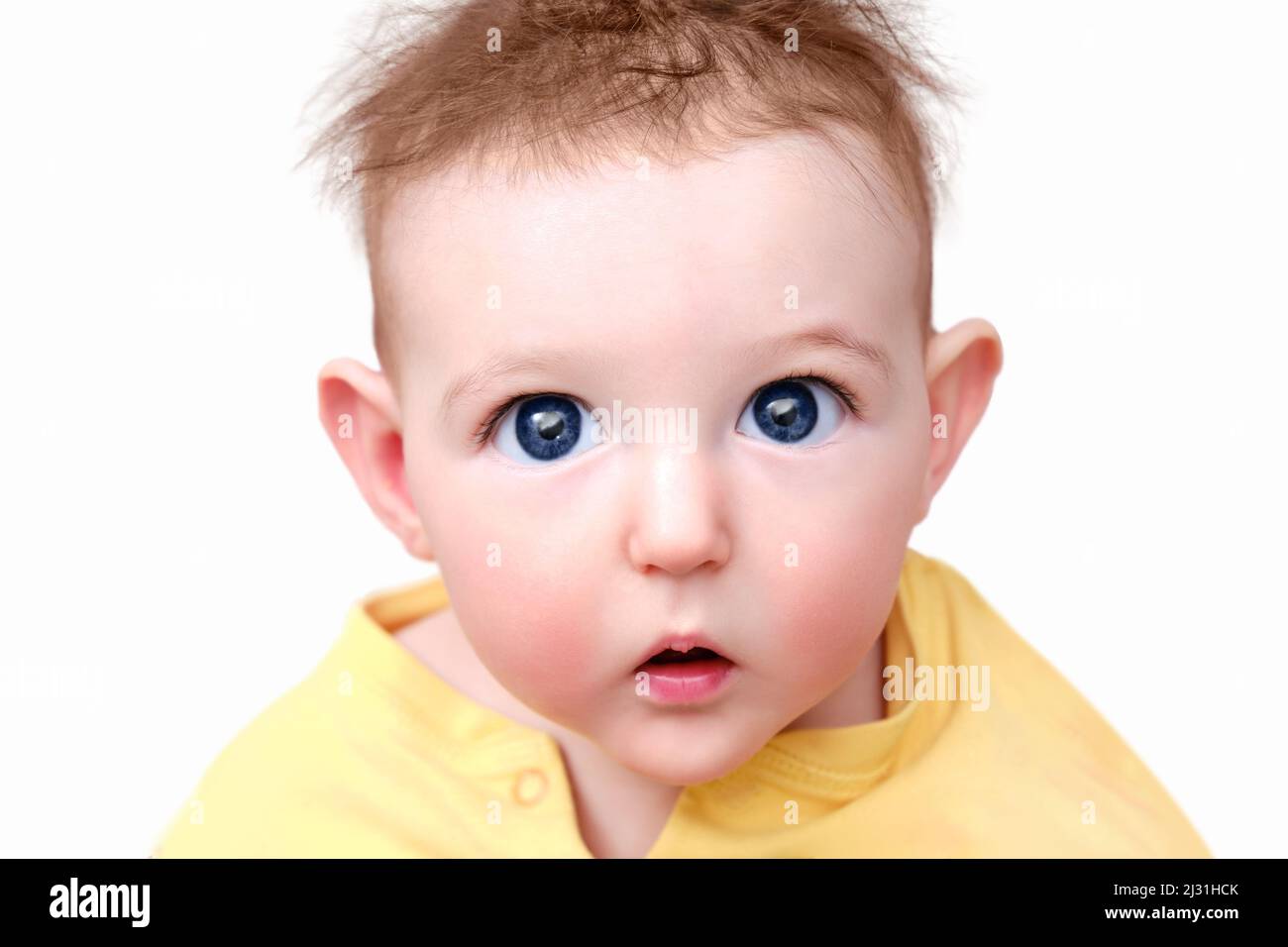 Surprised infant baby boy with big eyes on a white background, isolated ...