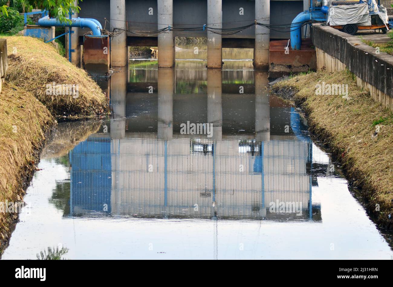 Outdoor photography floodgate aqueduct in a concrete wall for ...