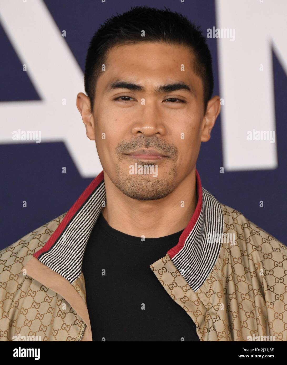 JB Tadena arrives at the AMBULANCE Los Angeles Premiere held at the ...