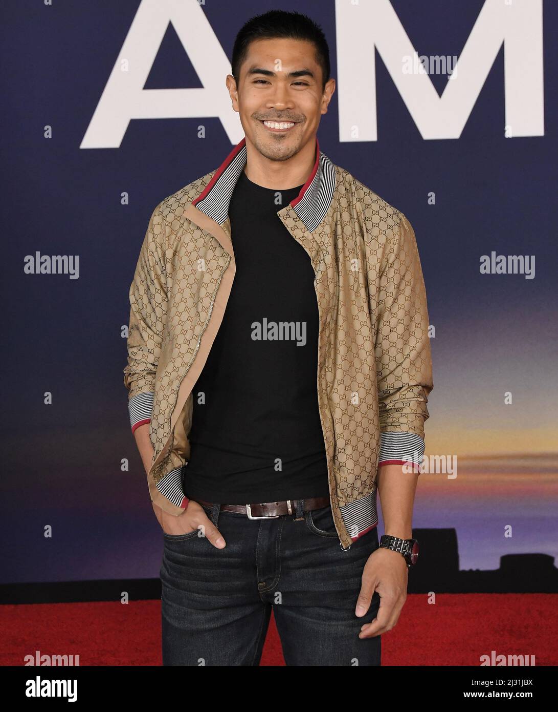 JB Tadena arrives at the AMBULANCE Los Angeles Premiere held at the ...