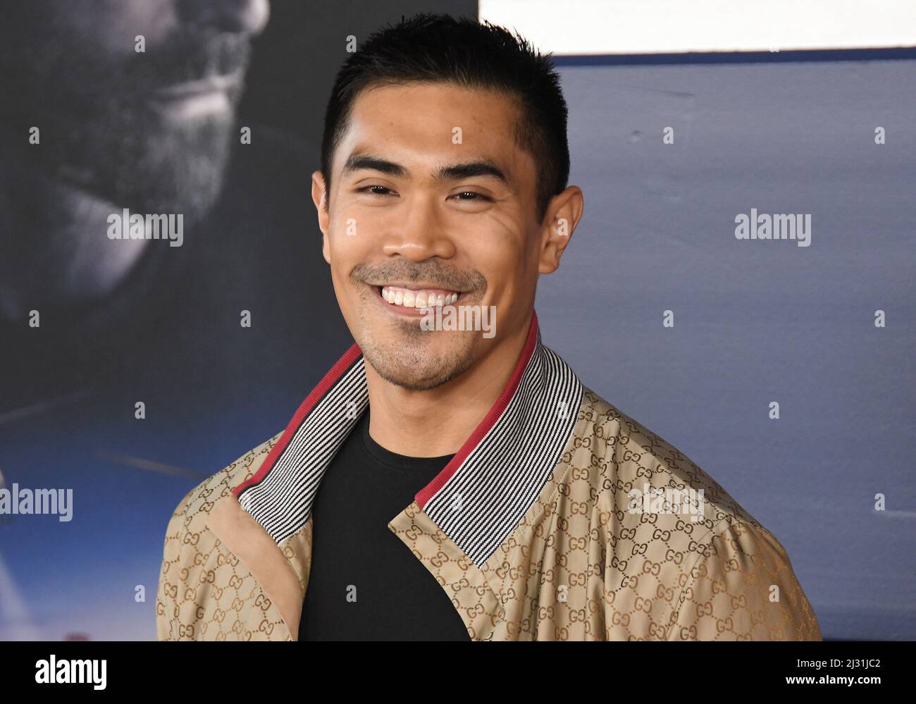 JB Tadena arrives at the AMBULANCE Los Angeles Premiere held at the ...