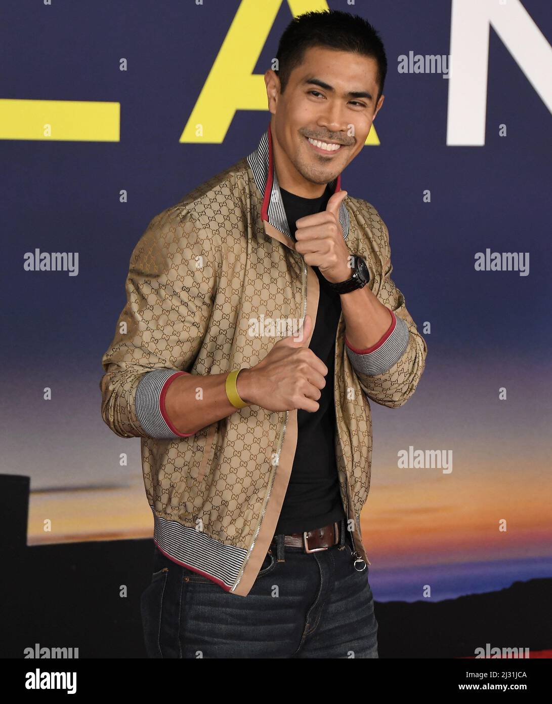 JB Tadena arrives at the AMBULANCE Los Angeles Premiere held at the ...