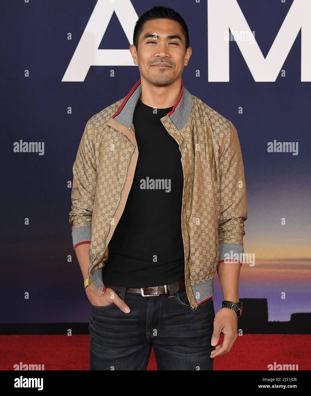 JB Tadena arrives at the AMBULANCE Los Angeles Premiere held at the ...