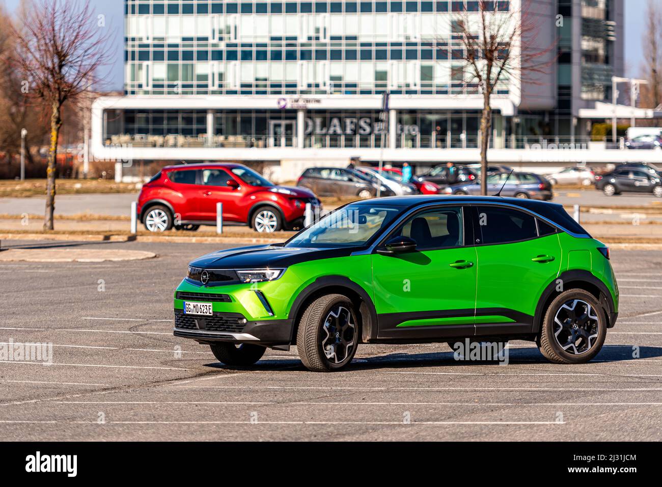 Riga, Latvia - 26 March, 2021: green electric vehicle Opel Mokka-e in ...
