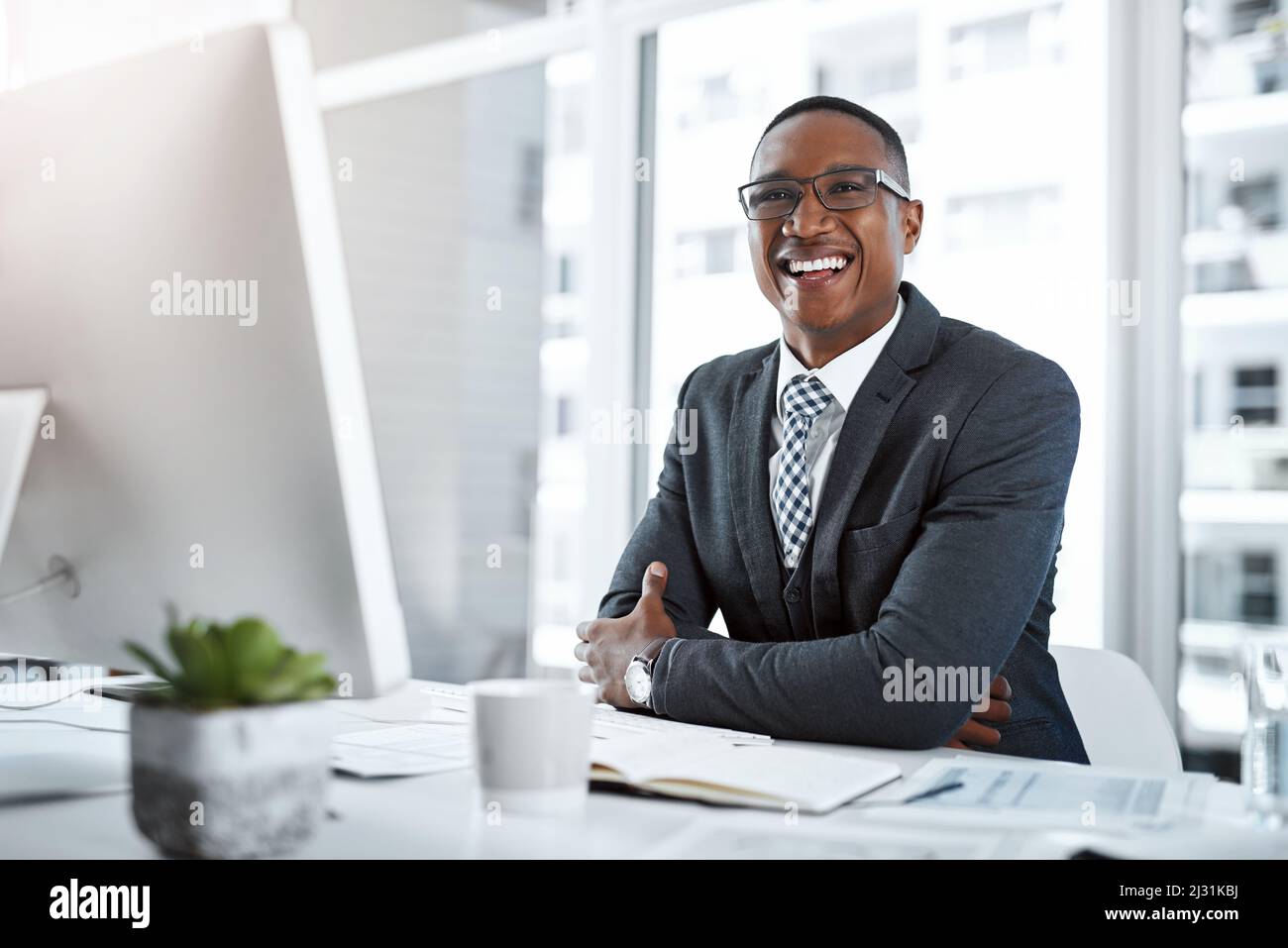 Nothing like positivity to boost productivity. Portrait of a young ...