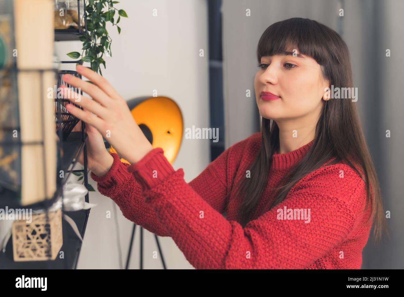 Beautiful millennial woman with long straight dark hair and red lips ...